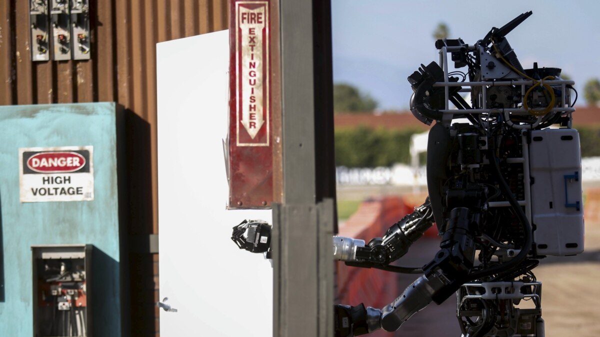 Next-Gen Robot Walks Like a Man, Stands Up to Being Pushed