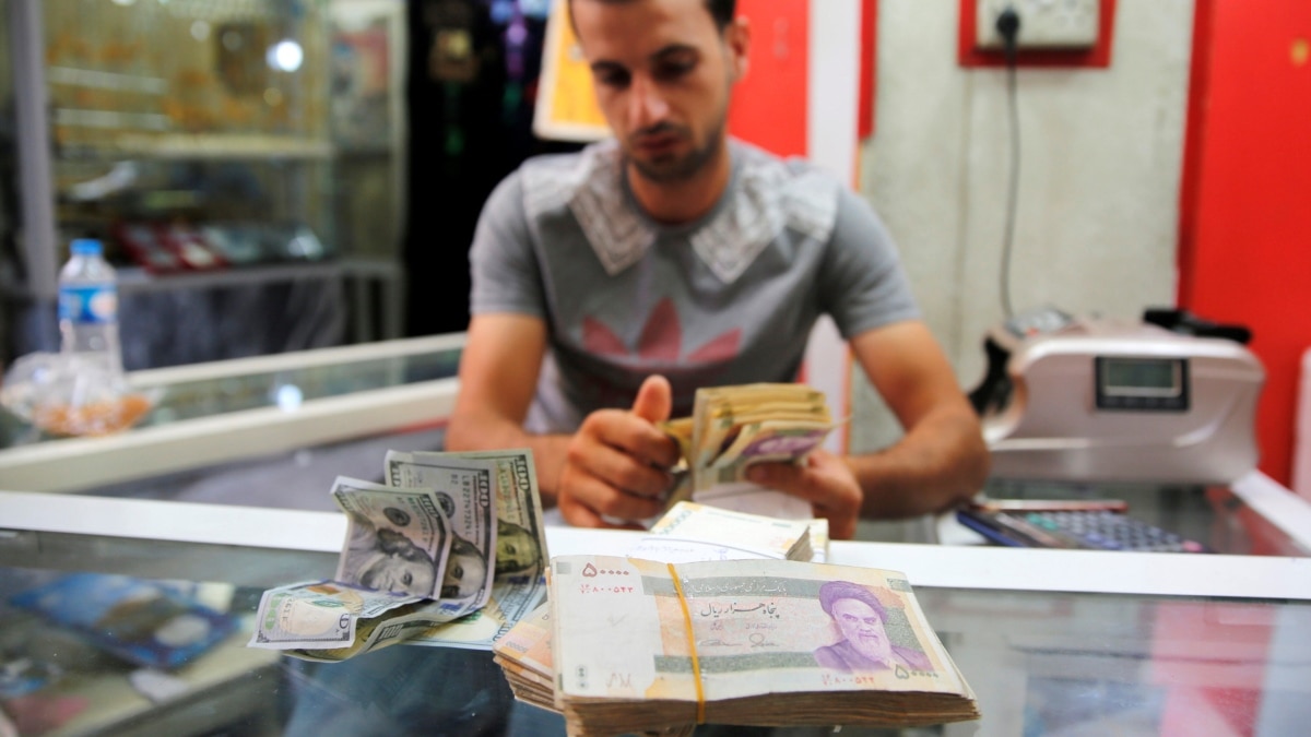 Bonbast Website: Iranian Rial Hits Record Low at 128,000 to Dollar