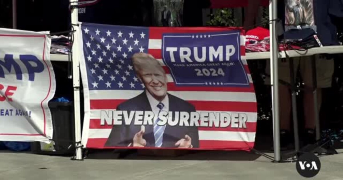 Trump and Harris merchandise sellers share space