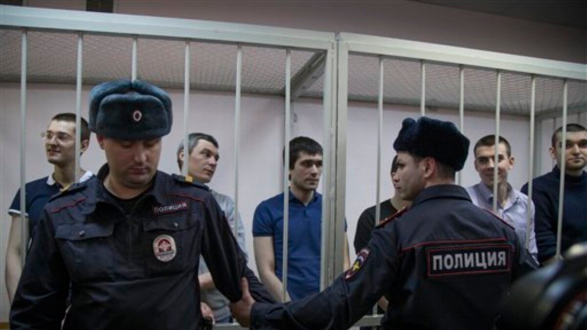 Eight Russians Convicted of Attacking Police