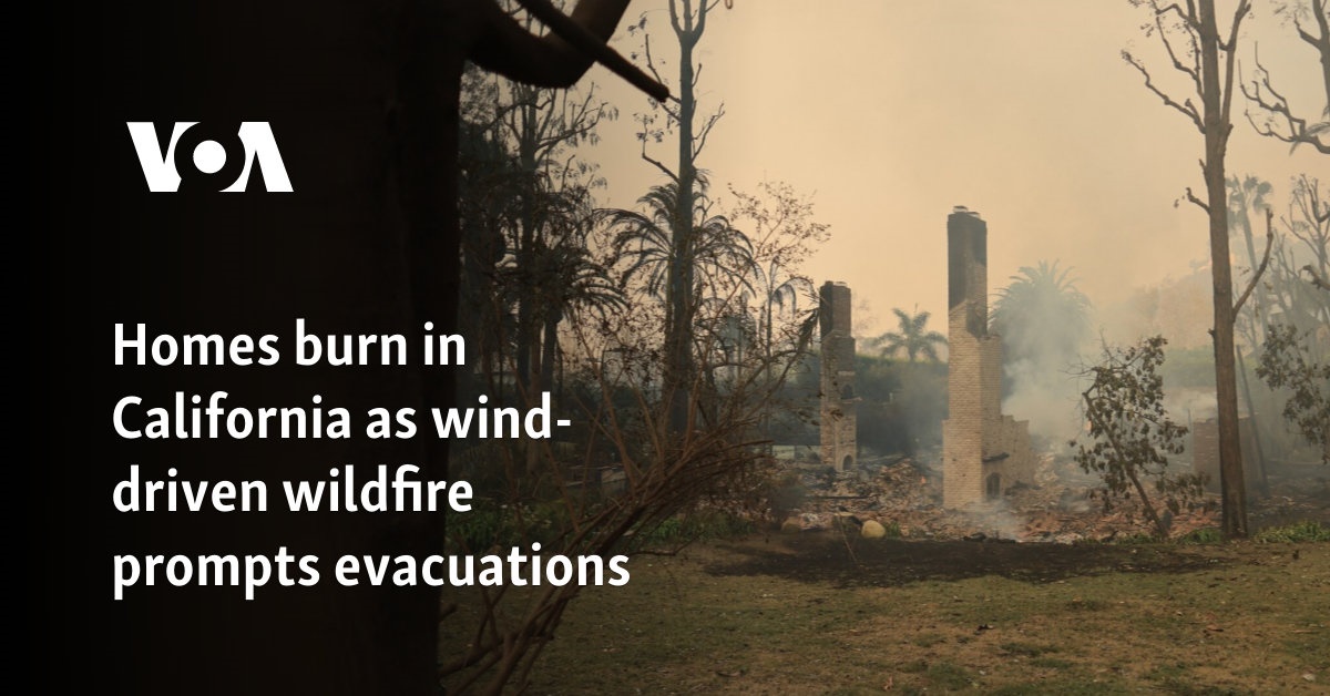 Homes burn in California as wind-driven wildfire prompts evacuations