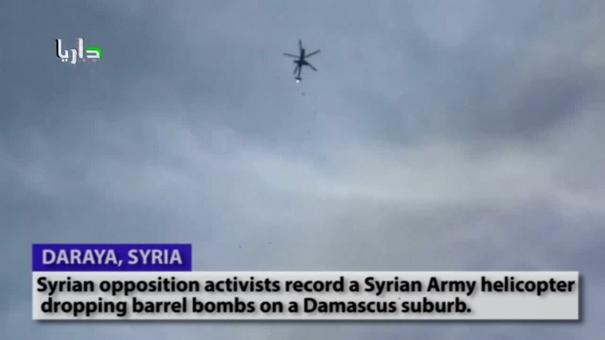 Watch: Helicopter Drops Barrel Bombs Over Daraya, Syria