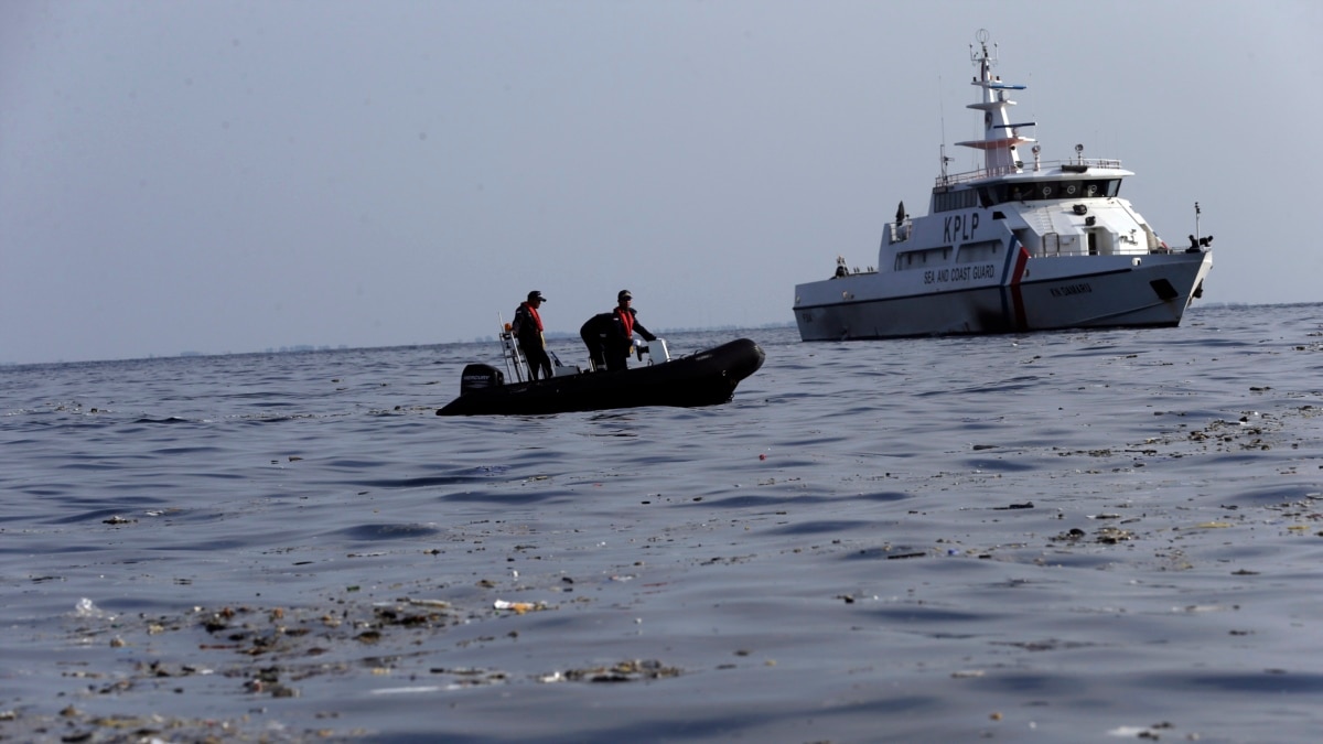 Indonesia Plane Crash Search Finds Remains, Debris At Sea