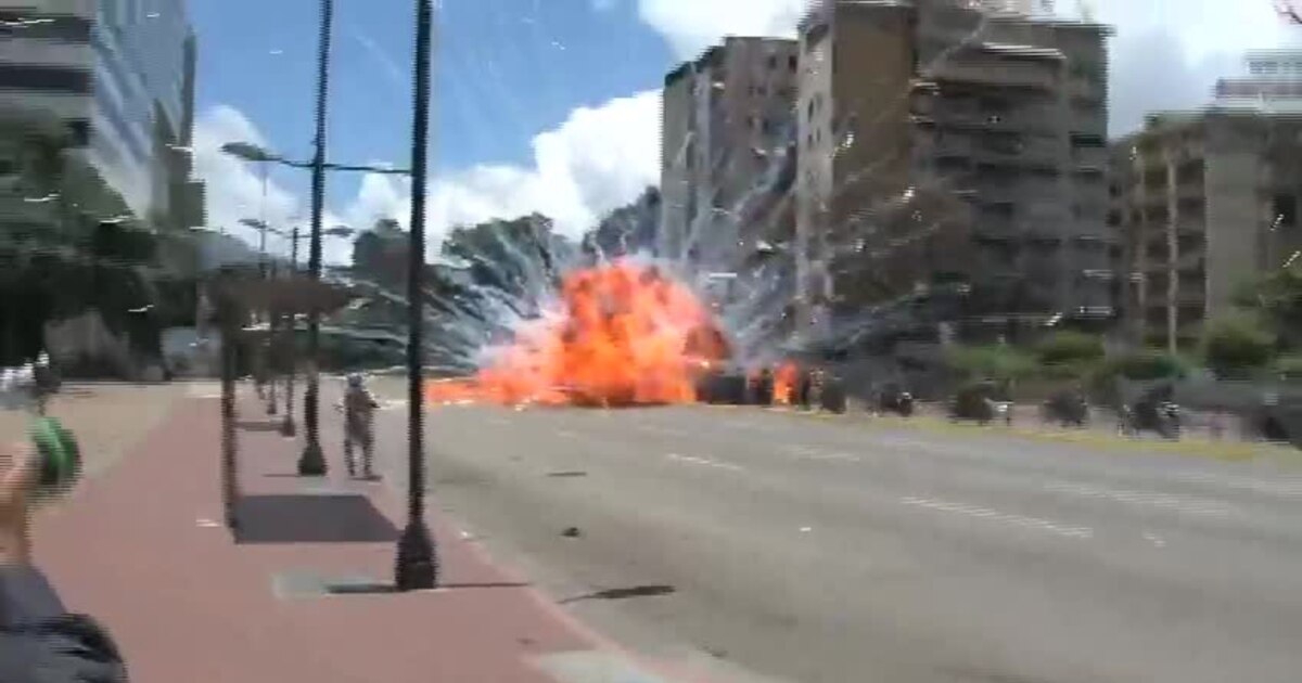 Explosion as Venezuela's National Guard Troops Pass on Caracas Street