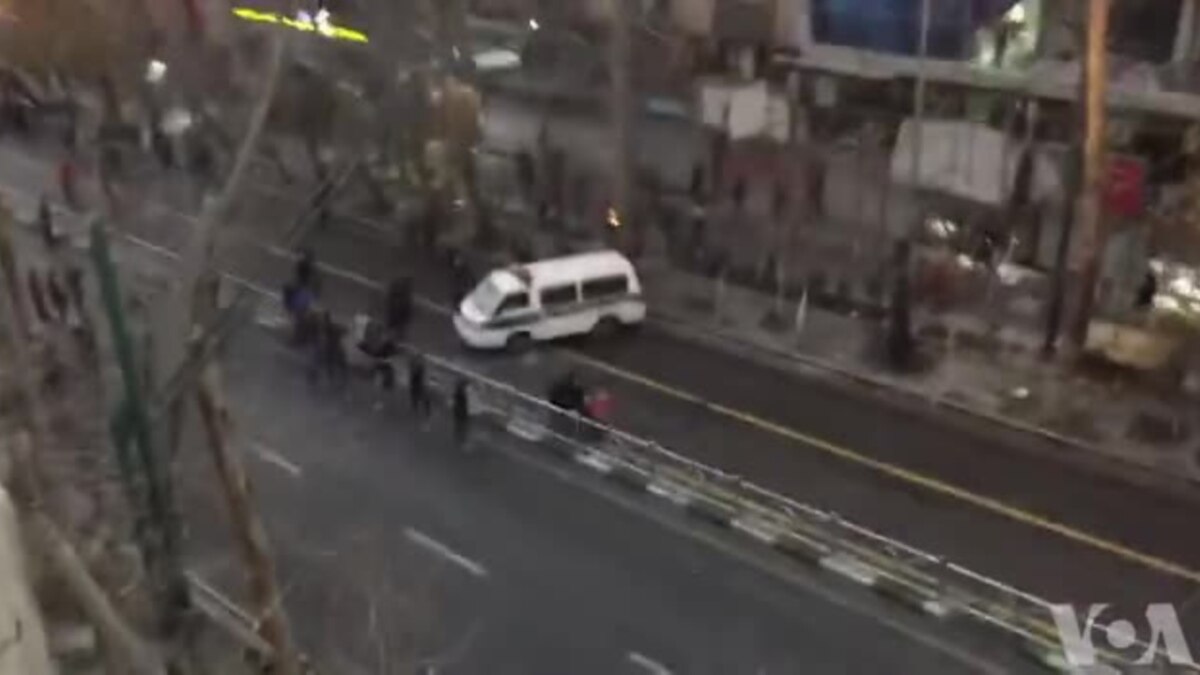 Protesters Overturn Iranian Police Van